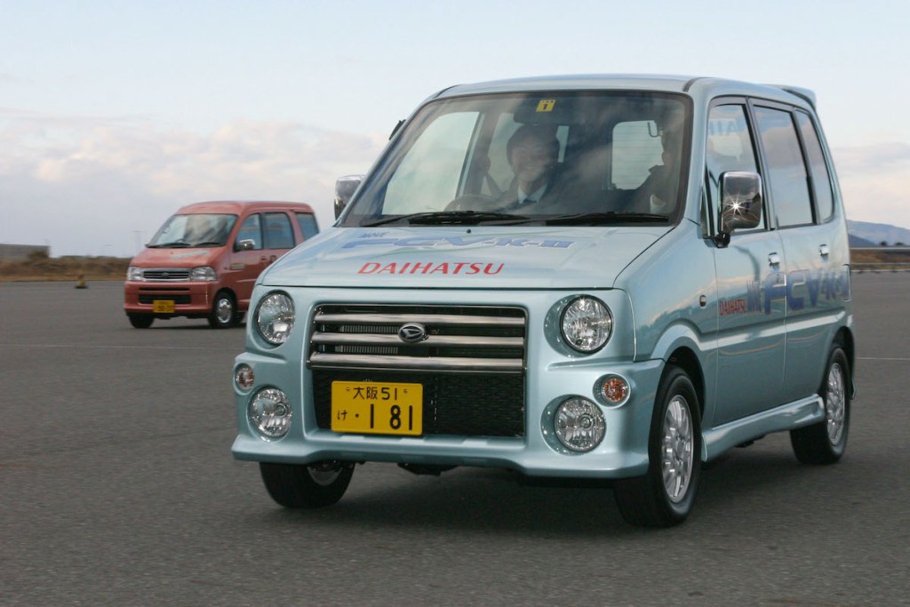 Tiny Daihatsu Hijet Camper Van Hides a Cute Log Cabin Inside