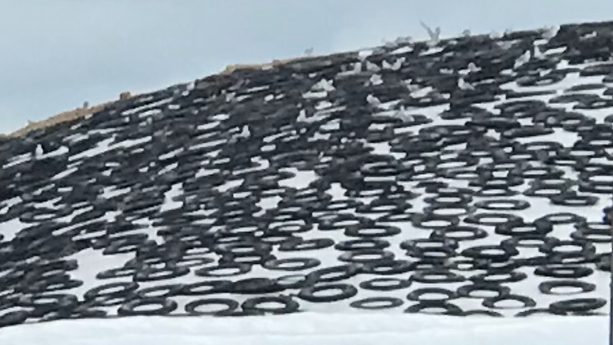 Why Do Farms Put Car Tires on Big White Tarps?