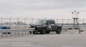 Watch 7,000-Pound Rivian Smash Through Guard Rail and Concrete Barrier