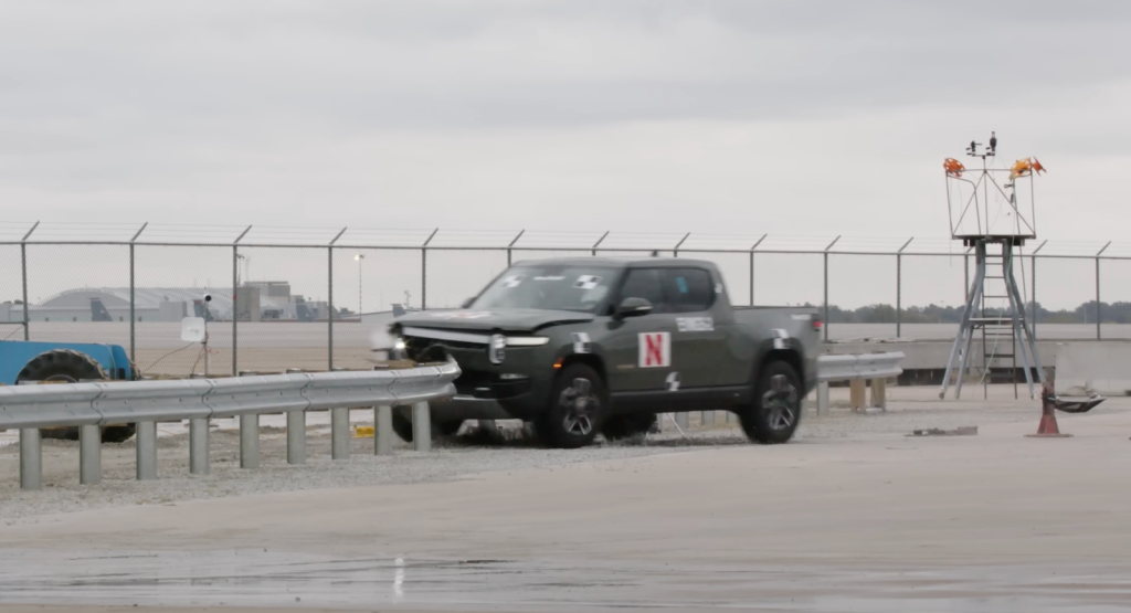 Watch 7,000-Pound Rivian Smash Through Guard Rail and Concrete Barrier