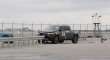 Watch 7,000-Pound Rivian Smash Through Guard Rail and Concrete Barrier