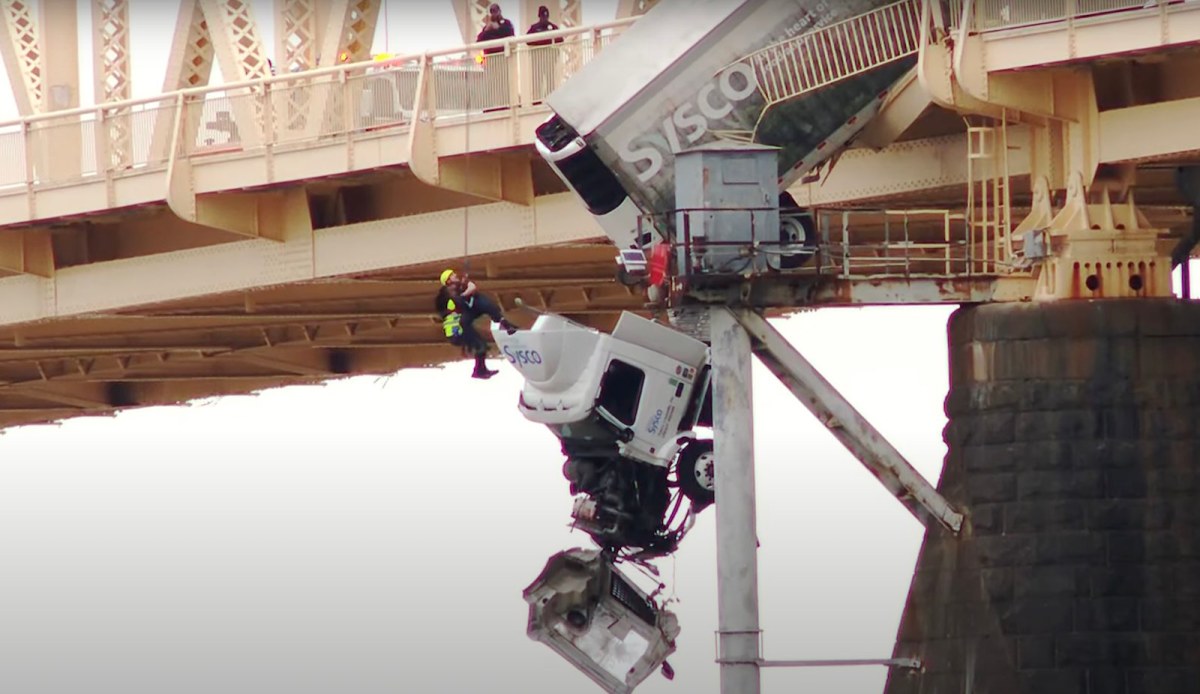 Firefighter Jumps off Bridge, Prays with Trapped Semi-Truck Driver ...