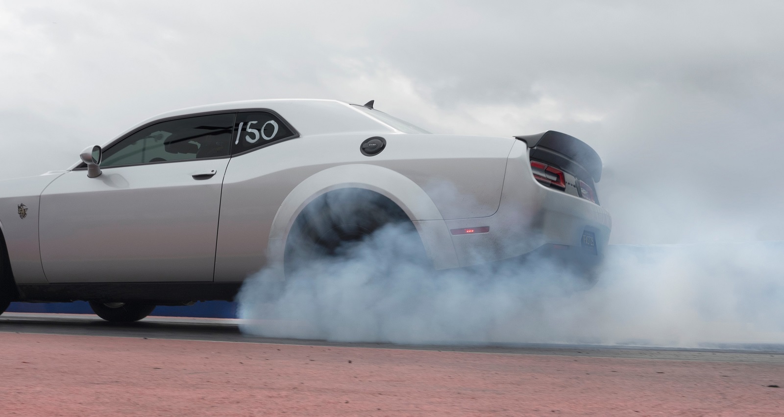 Dodge Challenger driver can't stop doing donuts, rams police car ...