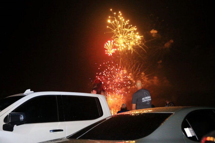Watch these firework-shooting drivers nearly light a car on fire while ...
